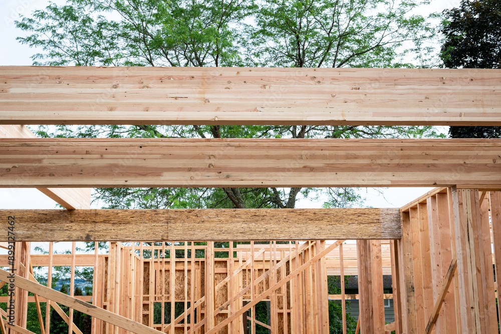 Closeup detail of new house construction, wall wood framing started and ...