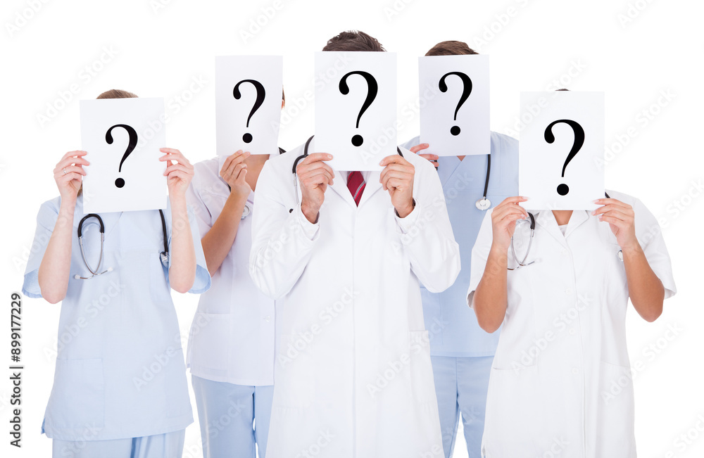 Medical team in full uniform meeting, holding question mark sign ...