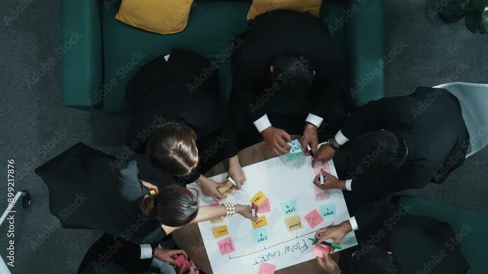 Top down view of business people hands making scrum task board to ...