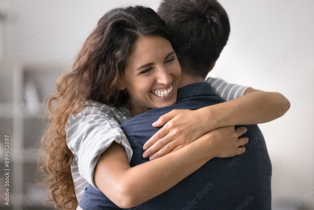 Happy loving pretty wife tenderly hug husband, congratulates him on ...