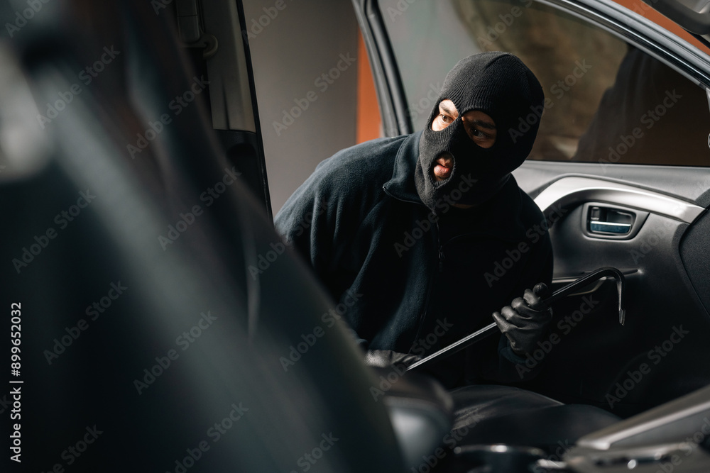 Thief in uniform black jacket various action stolen cars. The Robber ...
