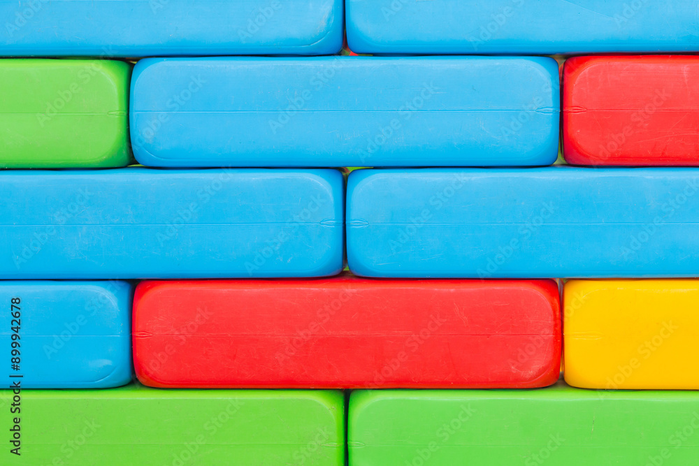 Brick wall texture. Colorful plastic toy blocks. Vibrant children ...