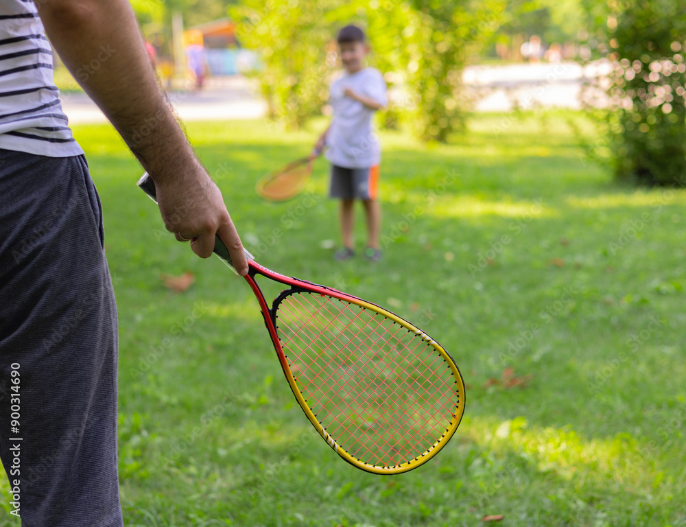 dad and son,kid and man playing outside in park badminton.child boy and ...