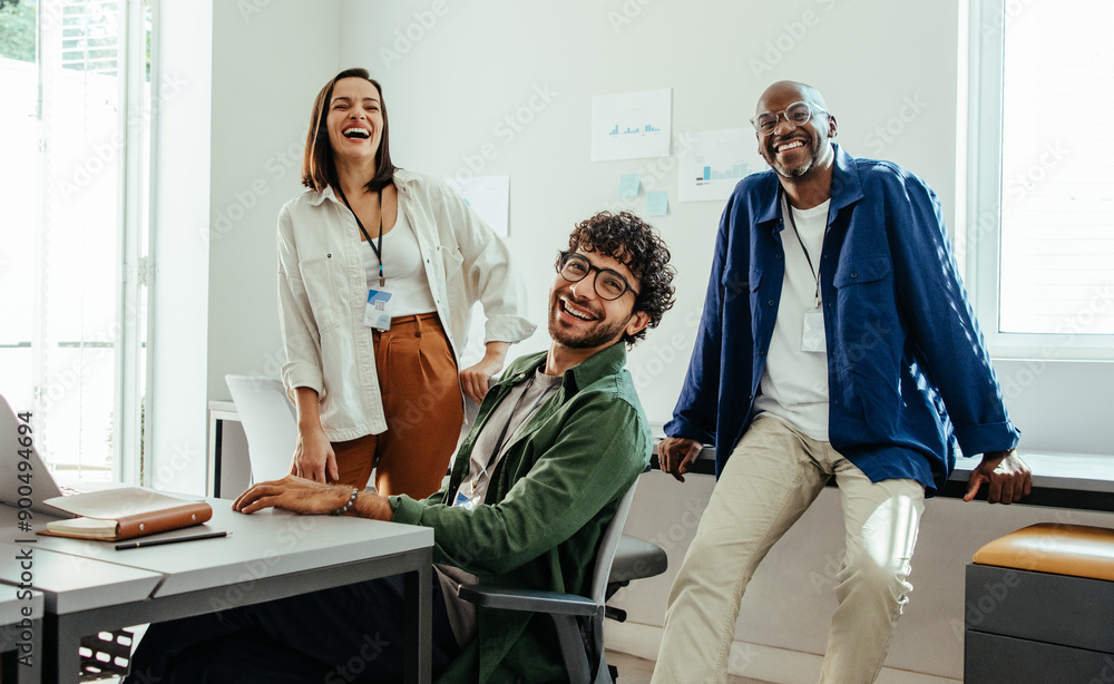 Diverse happy team of employees enjoying work at modern corporate ...