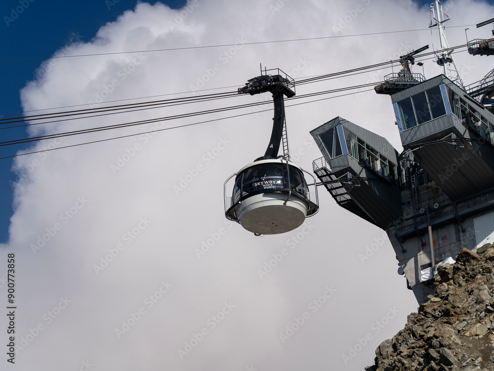 The SkyWay Monte Bianco cablecar is approaching the station at Punta ...