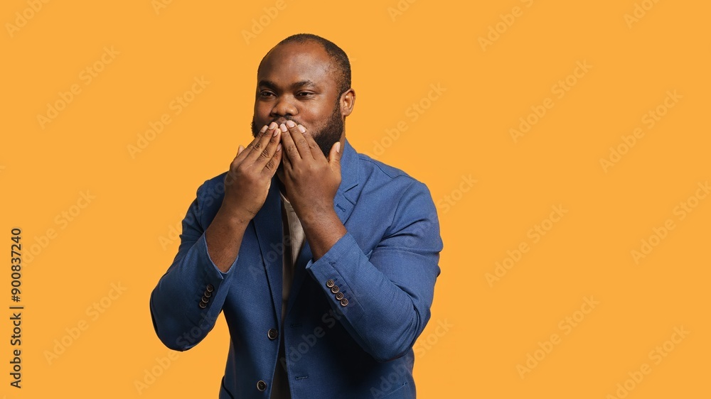 Frisky playful african american man blowing kisses to camera, being ...