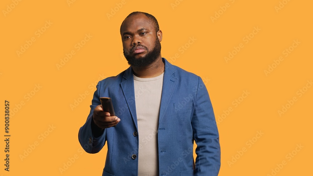 Man zapping through various TV channels, looking for entertaining ...