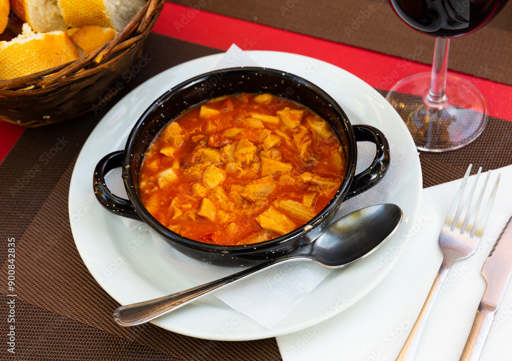 Traditional Spanish hearty and filling stew callos con garbanzos cooked ...
