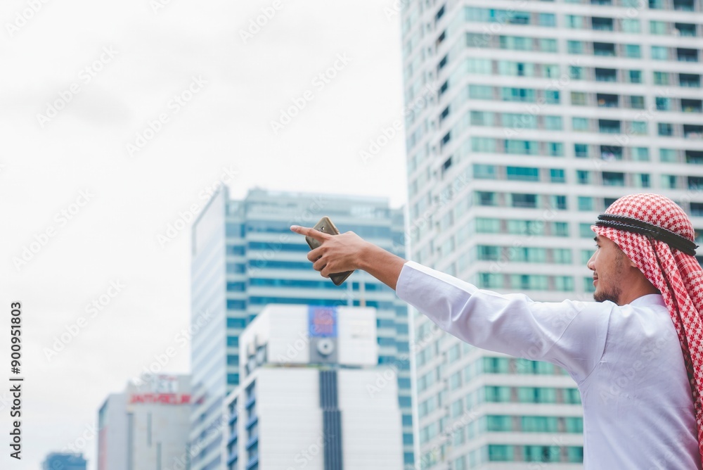 Backside Islamic man wear formal muslim dress in modern uae city. Arab ...