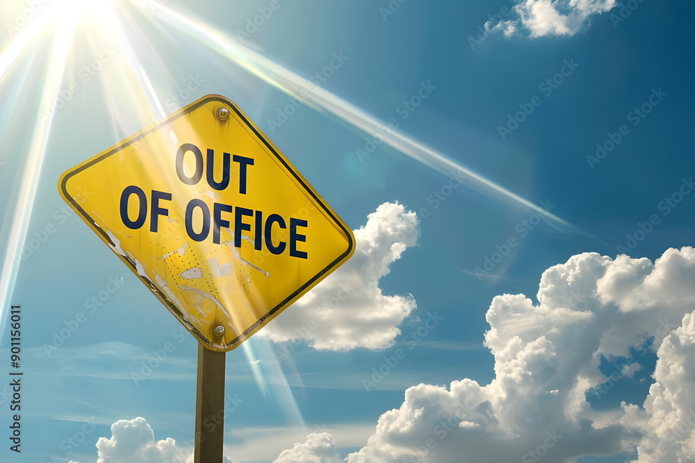 Bright yellow 'Out of Office' sign against a blue sky with sun and ...