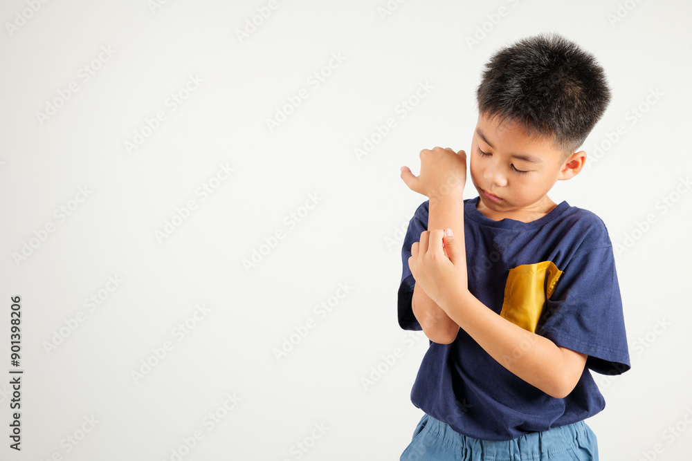 Asian little kid boy scratching itchy arm from a mosquito bite at ...