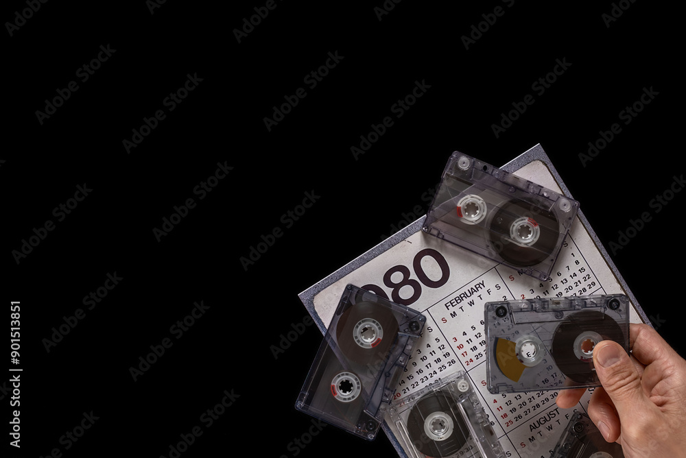 Man with old calendar and audio tape cassette having nostalgia of 80s ...