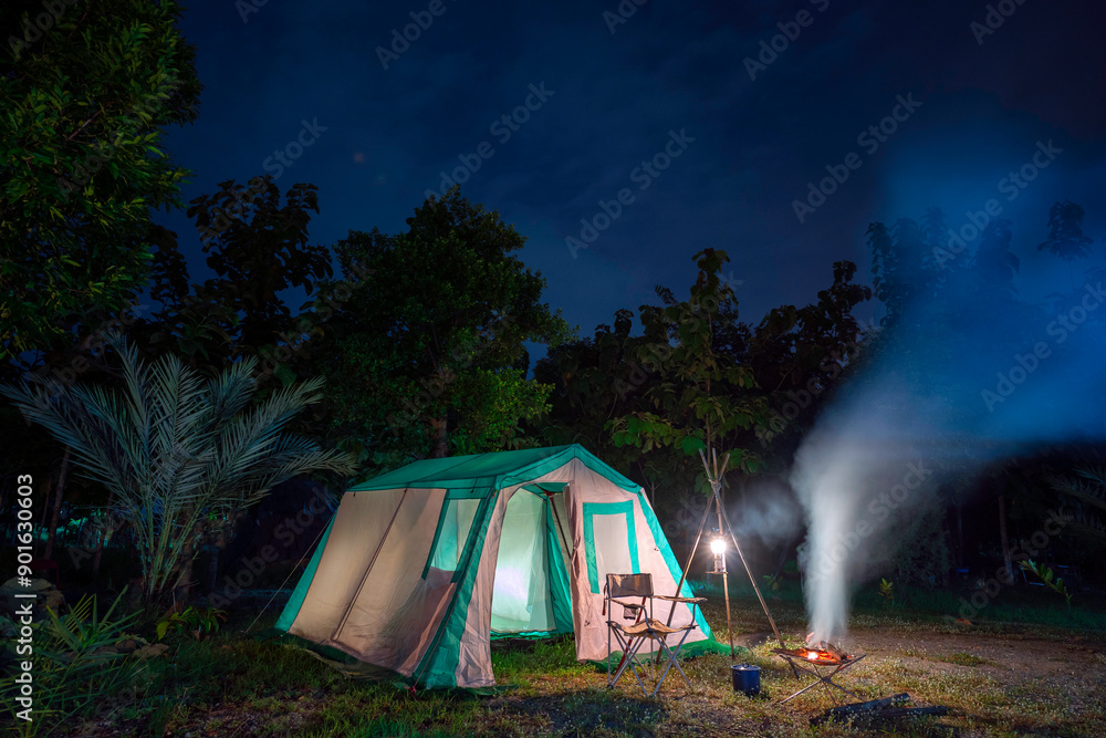 Camping tents at night, vintage cabin tents, antique oil lamps, retro ...