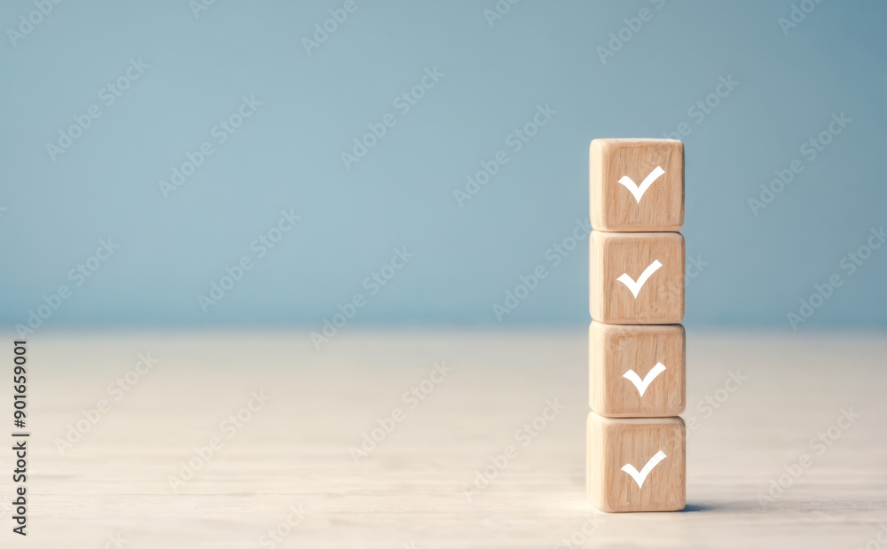 four wooden cubes marked tick check completed tasks. concept of ...