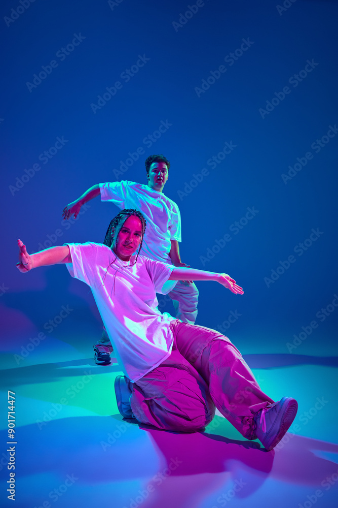 Artistic youth. Dynamic image of talented young girl and guy, hip-hop ...