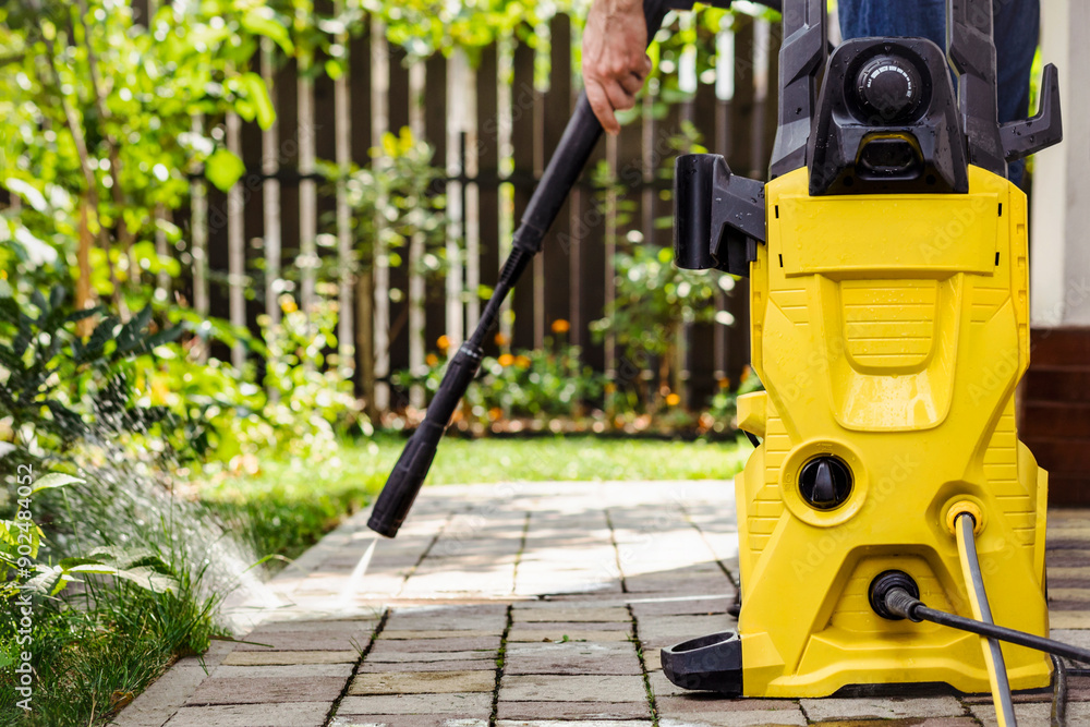 Pressure Washing Paving Slabs Floor in Patio Garden. High Pressure ...