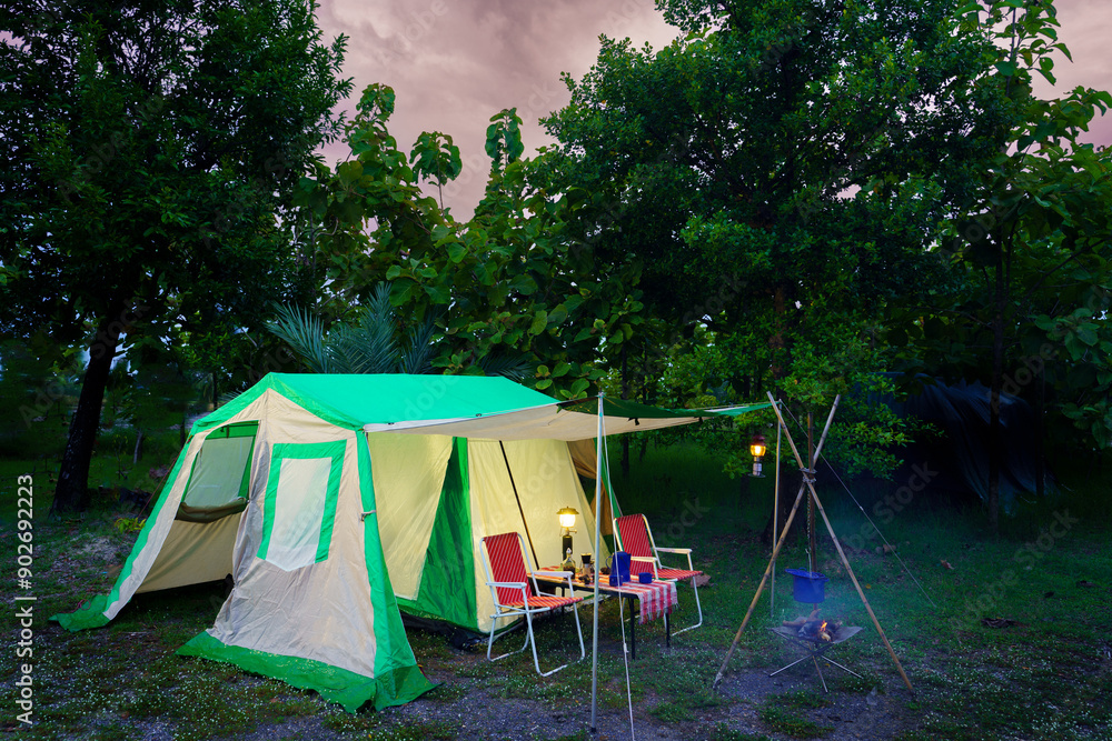 Camping tents at night, vintage cabin tents, antique oil lamps, retro ...