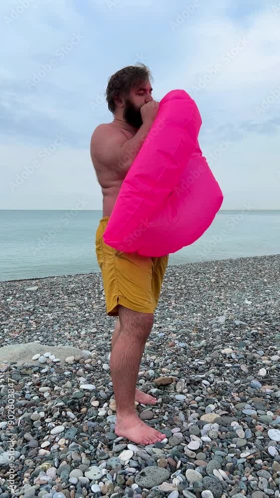 Vertical 4K video. Tanned fat white bearded man with big belly in ...