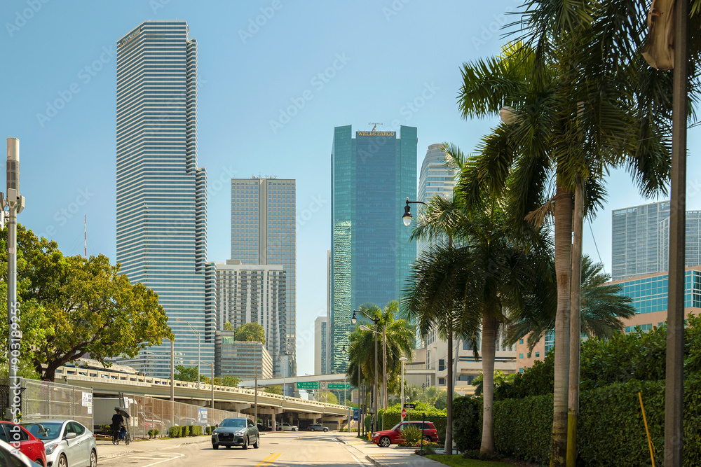 Cars traffic driving on American street with traffic lights in Miami ...
