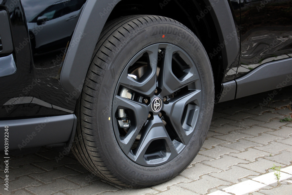 Vinnytsia, Ukraine; July 30, 2024. Black Toyota RAV4 Hybrid light alloy ...