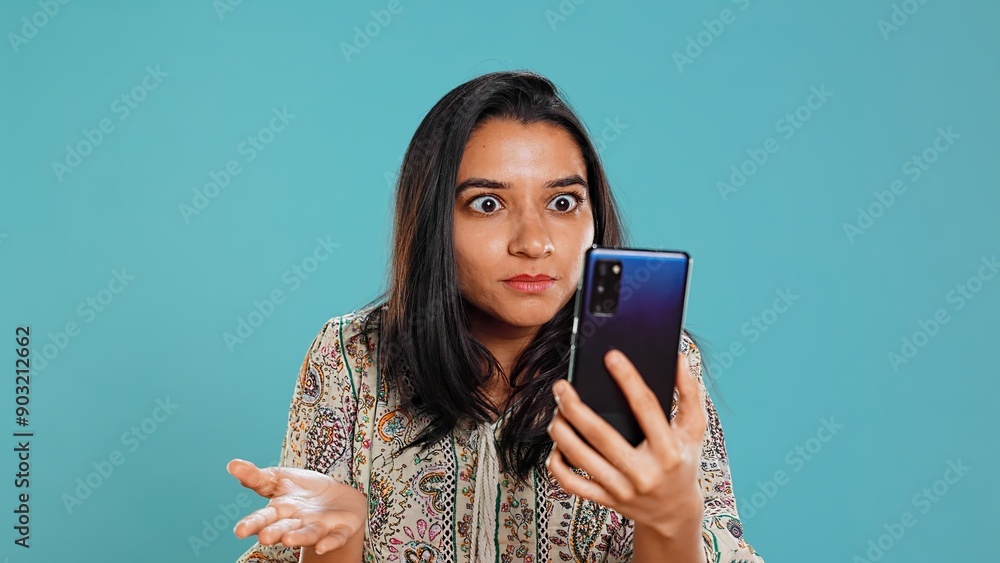 Irked woman fighting with friends during smartphone videocall, isolated ...