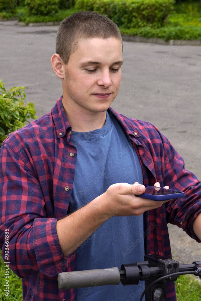 guy approaches the electric scooter and pays for its rent by scanning ...