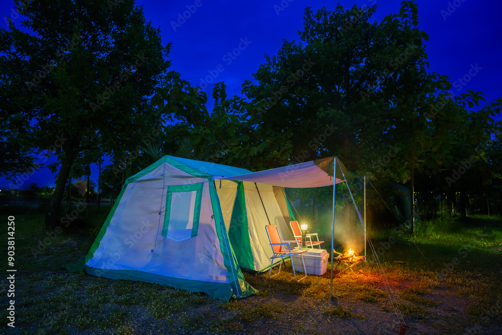 Camping tents at night, vintage cabin tents, antique oil lamps, retro ...