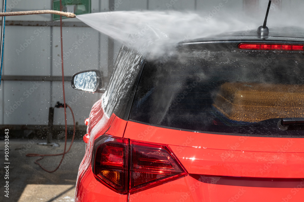 Washing auto with high pressure water jet at outdoor car wash. Stock ...