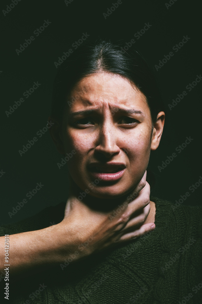 Woman, abuse and strangle with hand in studio for scared, anxiety or ...