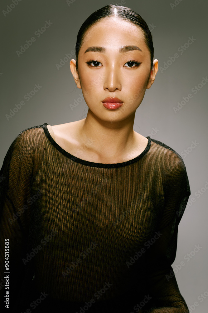 Asian woman sheer top gray background pose photo fashion an elegant ...