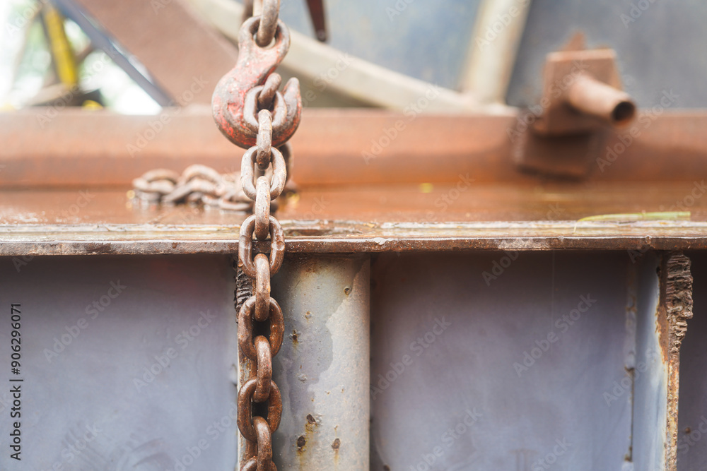 Steel chain and hook securing anchor, using to secure heavy object that ...