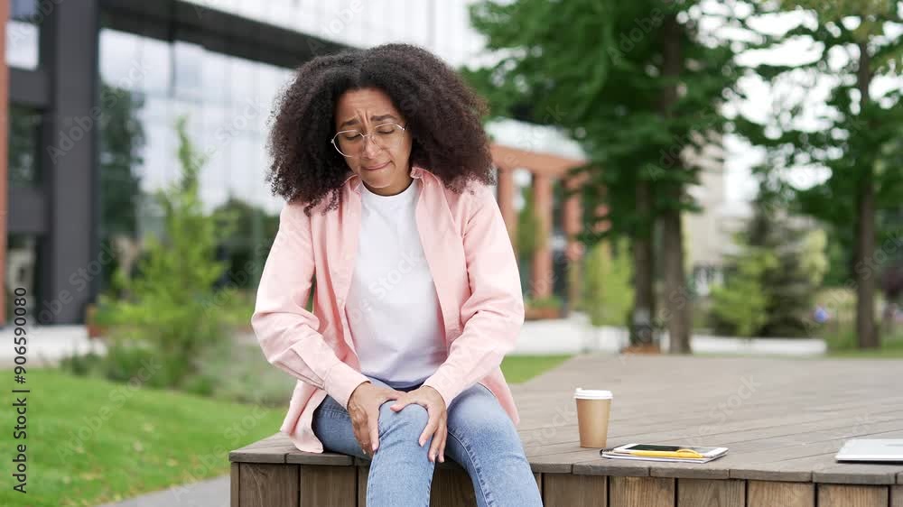 African american female student suffers from painful severe knee joint ...