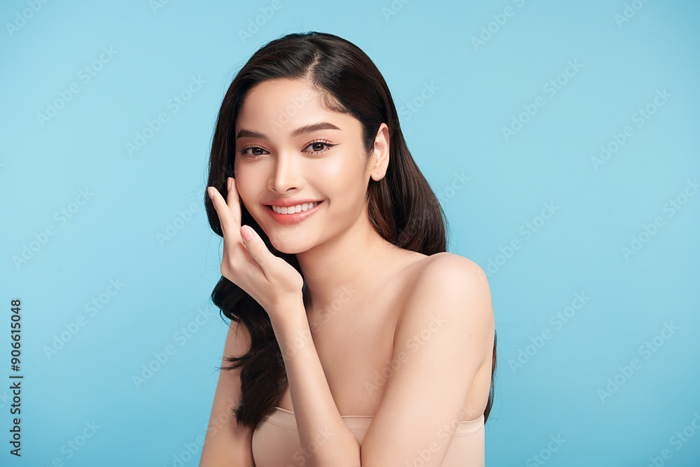 Beautiful Young transgender woman with clean fresh skin on blue ...