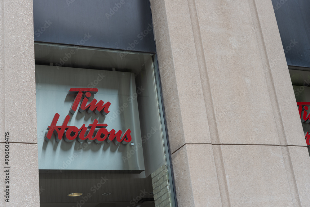 exterior building facade and sign of Tim Hortons, a coffee shop chain ...