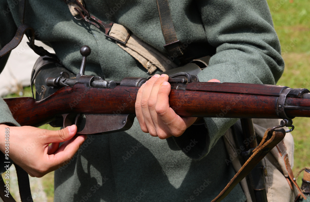 Soldier in the Army uniform from the First World War hand loading an ...