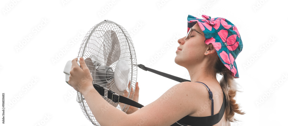 Fotka „Heat,abnormal heat,woman cooled by fan mobile fan,heat stroke ...
