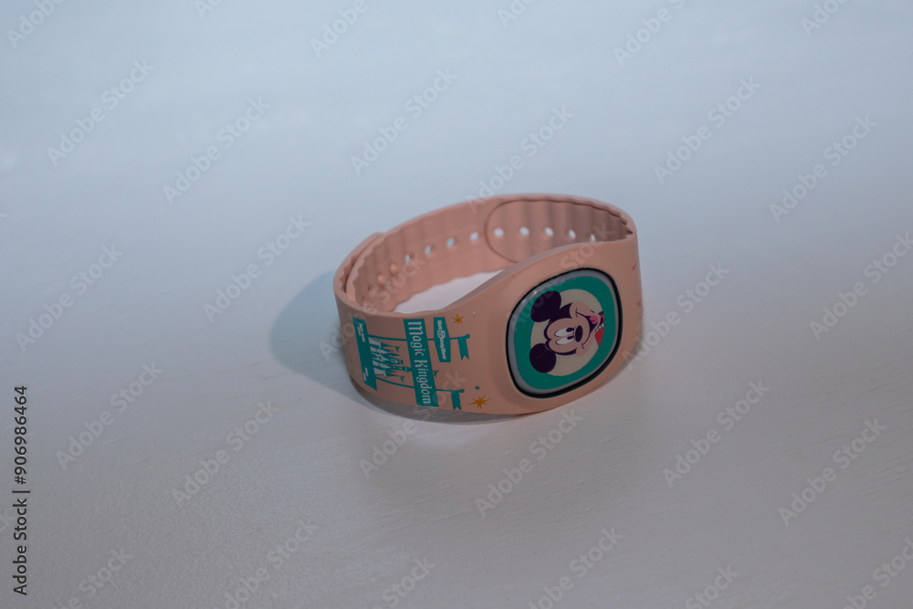 Pink retro Disney Magic band on white background. Bands used for park ...
