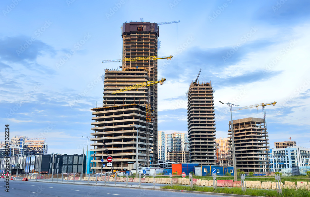 Construction of a skyscraper. Tower Crane on formworks on construction ...