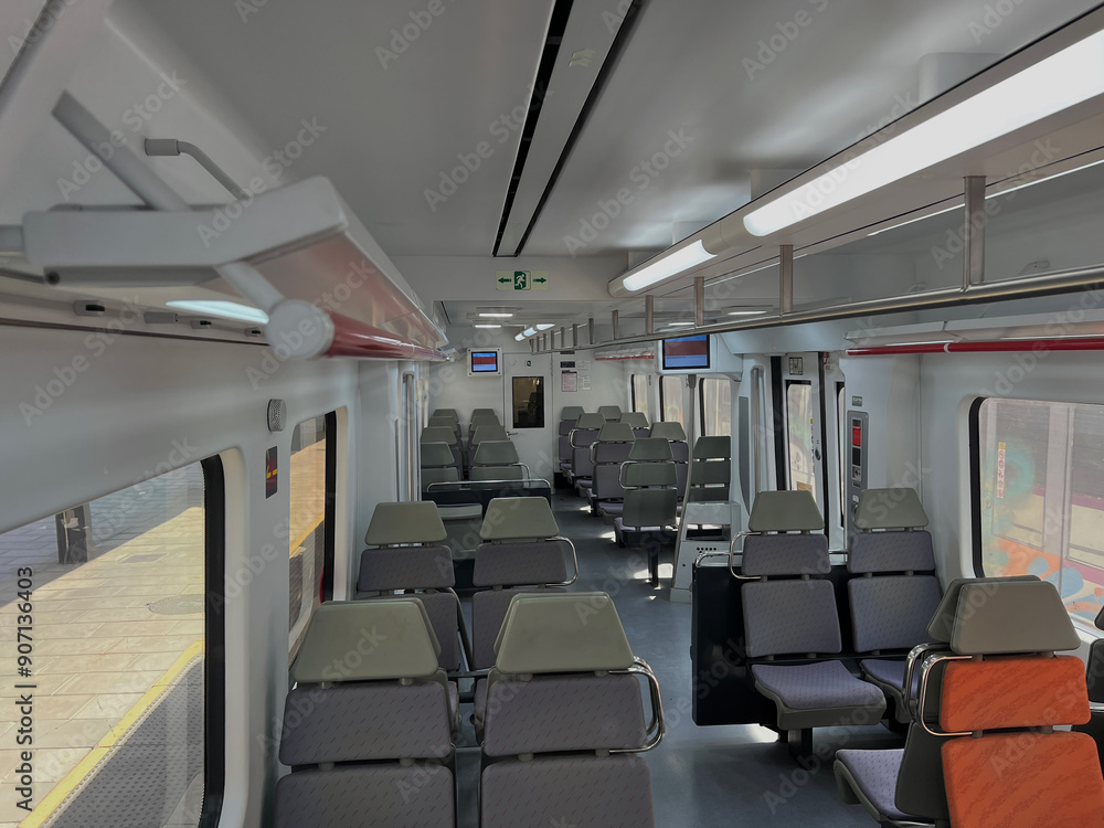 Empty cabin of a modern passenger train. Empty seats inside train cabin ...