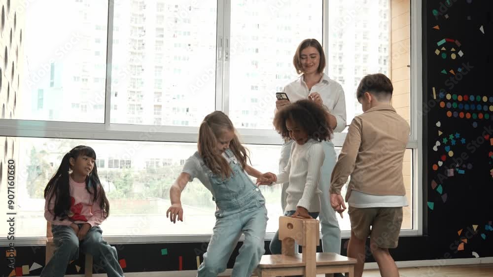 Diverse children playing musical chairs games while young smart ...