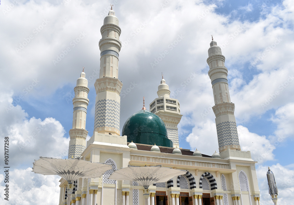 A beautiful mosque with one big green dome and four tall minarets Stock ...