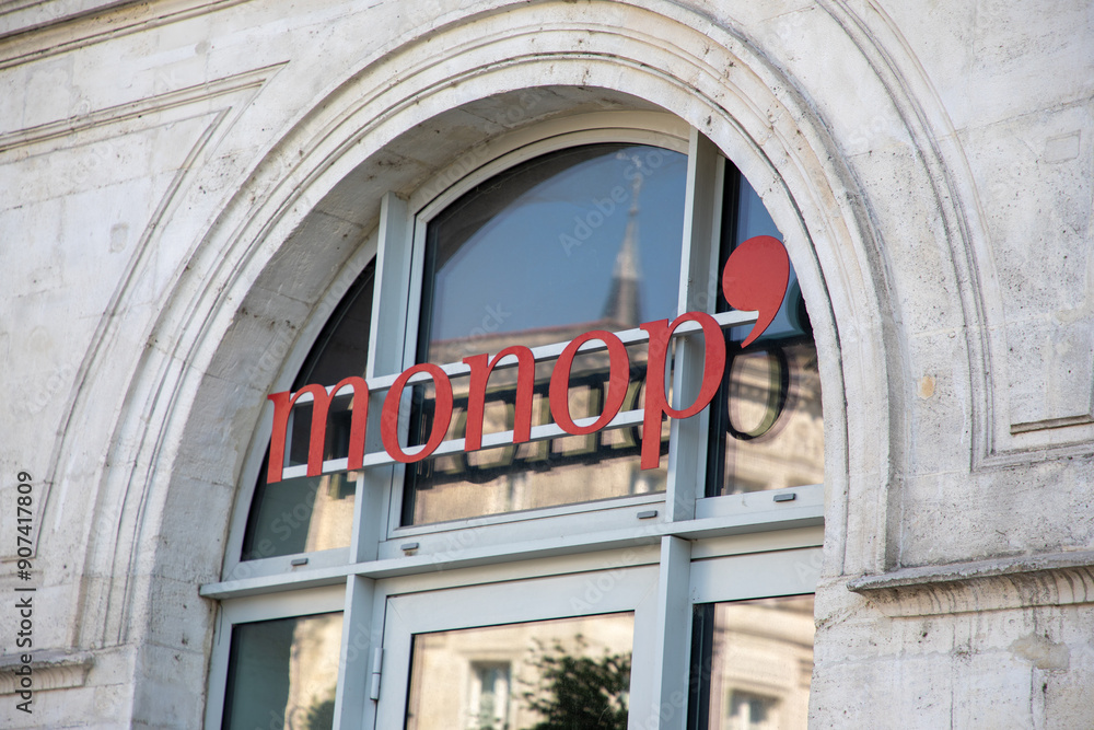 Monop' logo sign and text brand on city building of chain french ...