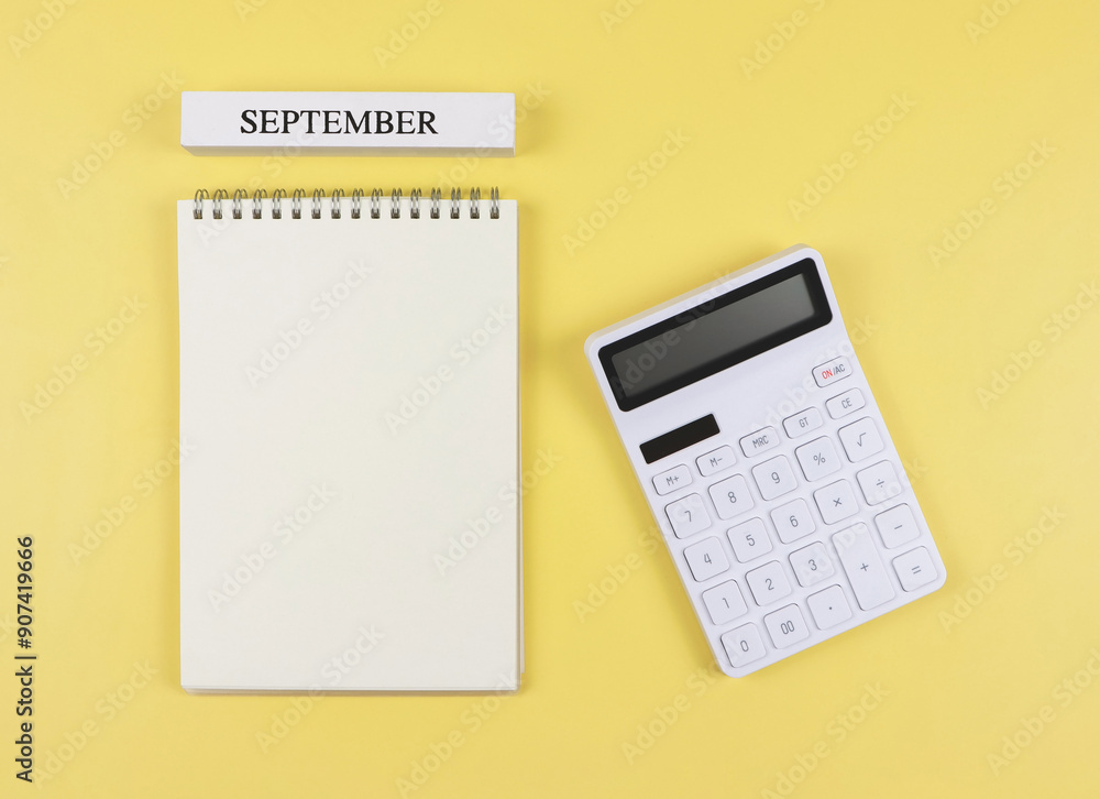 flat layout of opened blank page notebook with wooden calendar ...