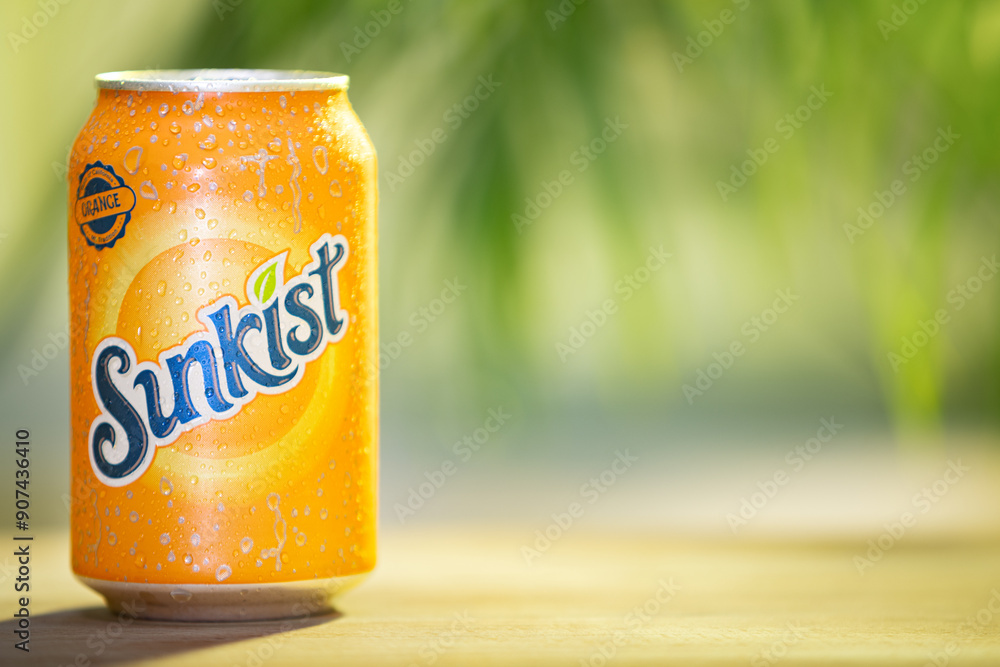 Vibrant and refreshing can of Sunkist orange which is covered in ...