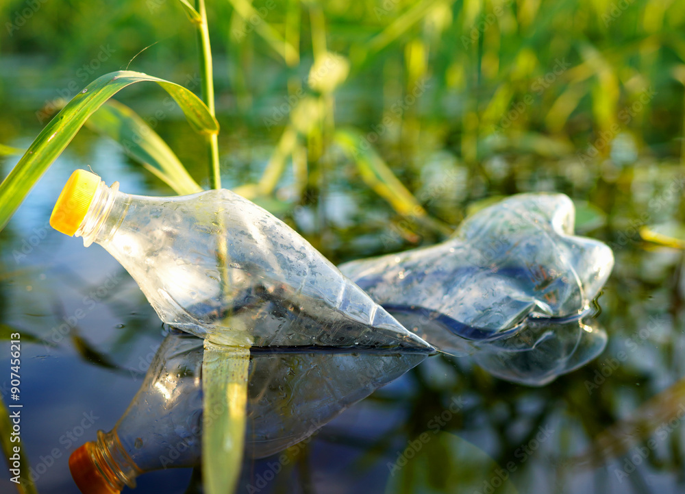Marine plastic pollution. Plastic waste in lake. Microplastics ...