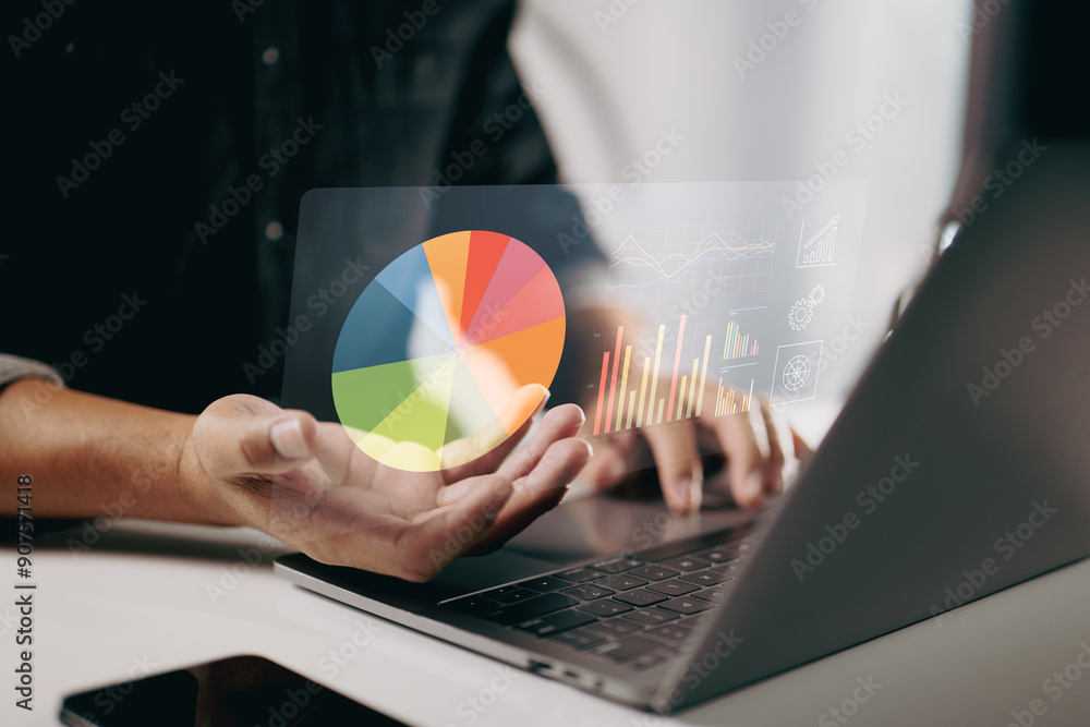 person using a laptop with floating pie charts and graphs. It ...
