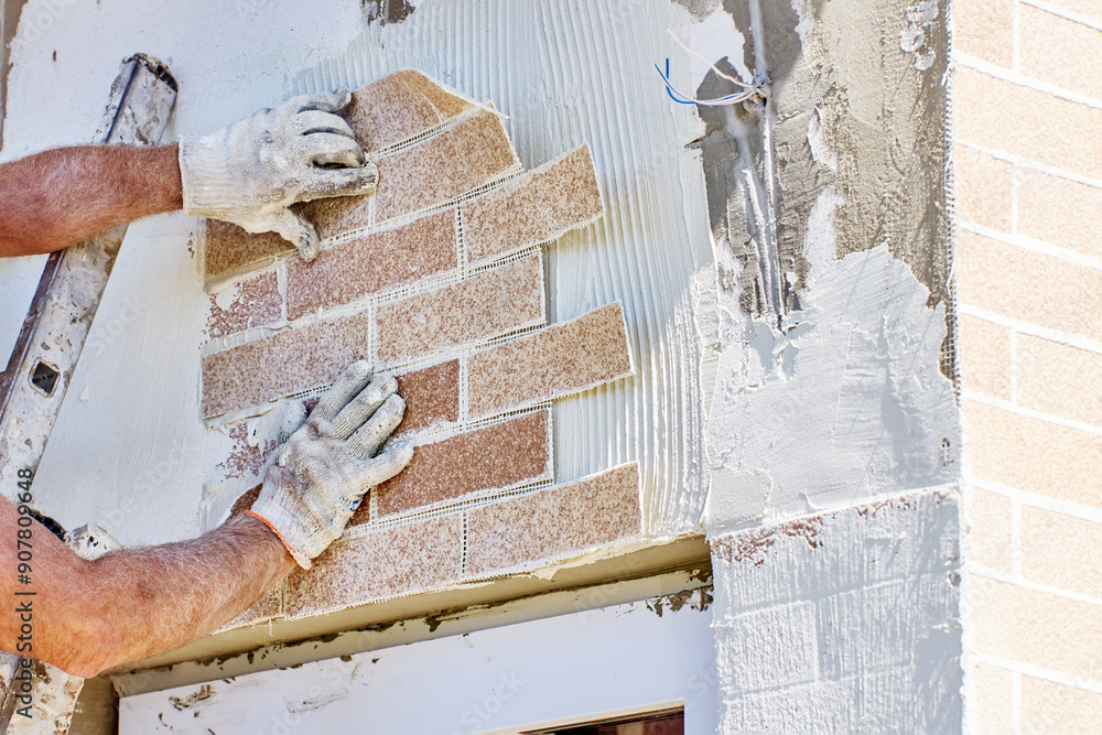 DIY Facade Finish With Imitation Brick, homeowner adding panel with ...