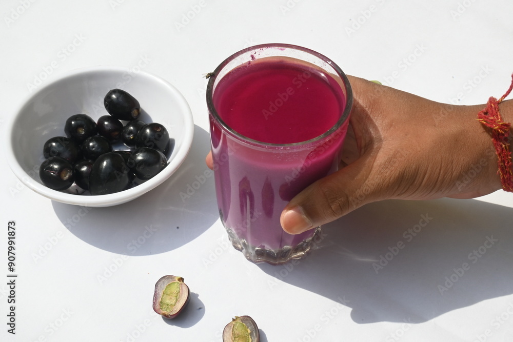 Syzygium cumini fruits juice. Its other names Malabar plum, Java plum ...