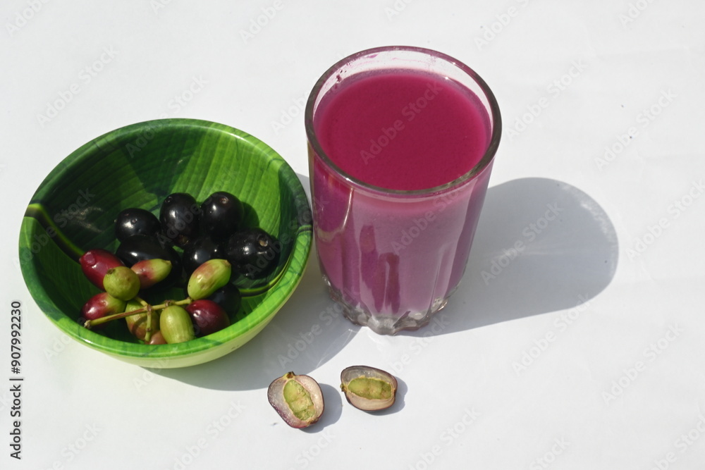 Syzygium cumini fruits juice. Its other names Malabar plum, Java plum ...