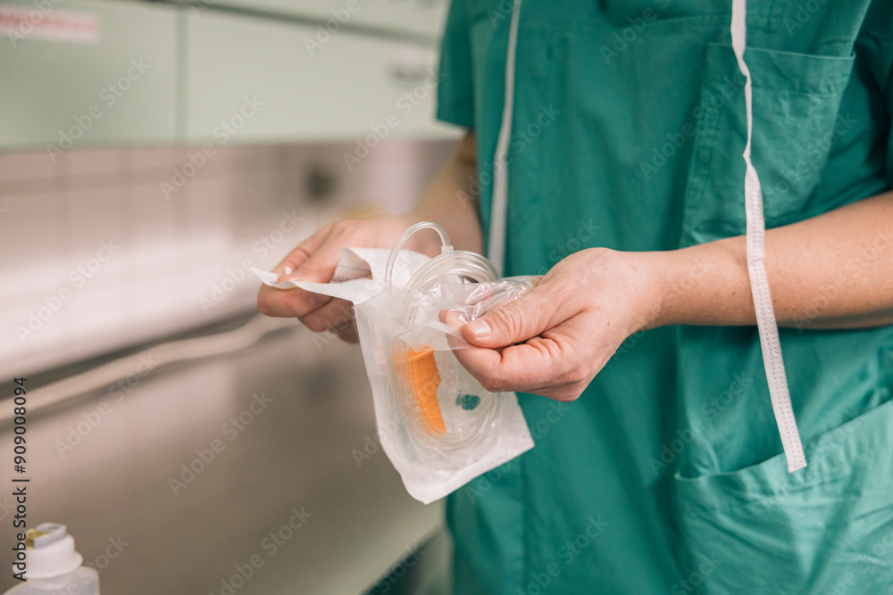 Poster Medical staff member setting up an IV catheter for venous access ...